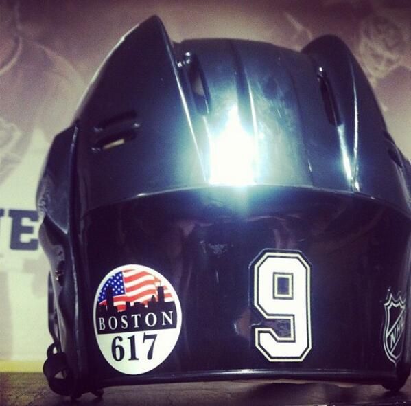 Penguins wearing "Boston 617" logos on helmets.